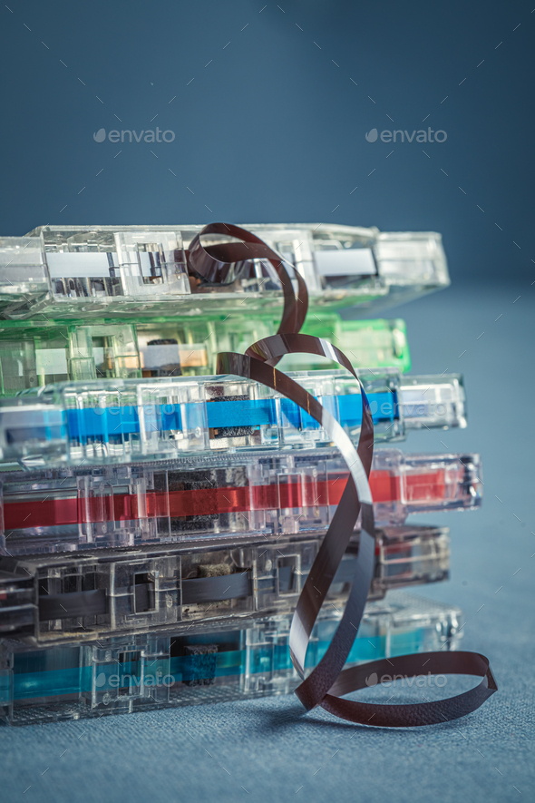 Pile of old cassette tapes with an extracted tape Stock Photo by Shaiith
