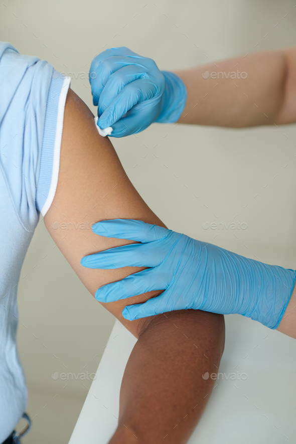 Nurse Wiping Arm of Patient Stock Photo by DragonImages | PhotoDune