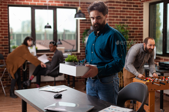 Sad Dismissed Man Holding Box With Belongings After Being Fired Stock