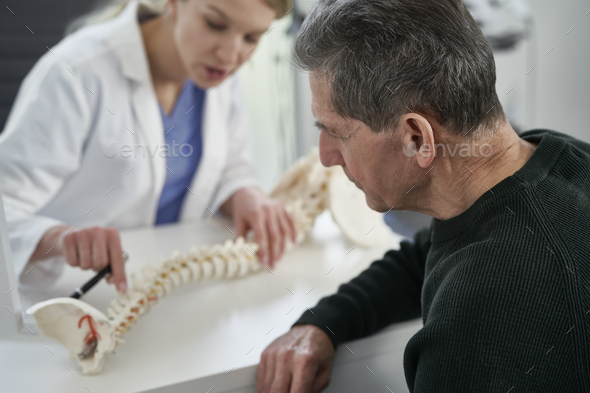 Caucasian senior man at the doctor's visit Stock Photo by gpointstudio