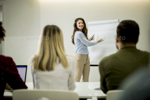 Creative positive female leader talking about business plan with ...