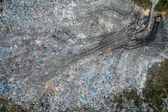 Bulldozer on open solid waste dump, Poland from above Stock Photo by ...