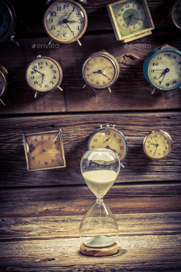 Hourglass as the old way of timing on clocks backgrounds Stock Photo by ...