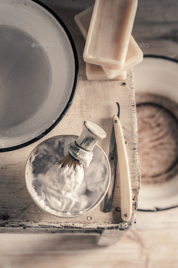 Vintage tools for shave. Sharp razor, soap and brush Stock Photo by Shaiith