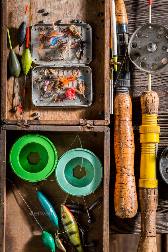 Closeup of angler equipment with fishing rod and lures Stock Photo by ...