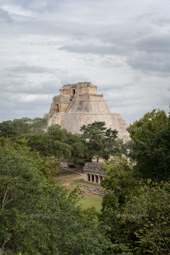 Uxmal temple complex in Yucatan, Mexico, grey sky Stock Photo by lizzykomen