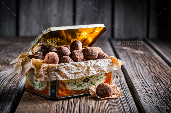 Chocolate balls in the old red box Stock Photo by Shaiith | PhotoDune