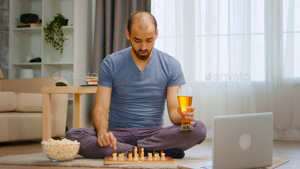 Man playing chess on video call Stock Photo by DC_Studio | PhotoDune