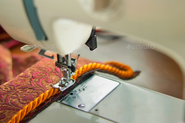 Modern sewing machine presser foot and decorative edging cord. Sewing ...