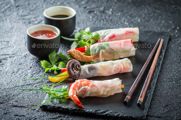 Tasty spring rolls made of fresh vegetables Stock Photo by Shaiith