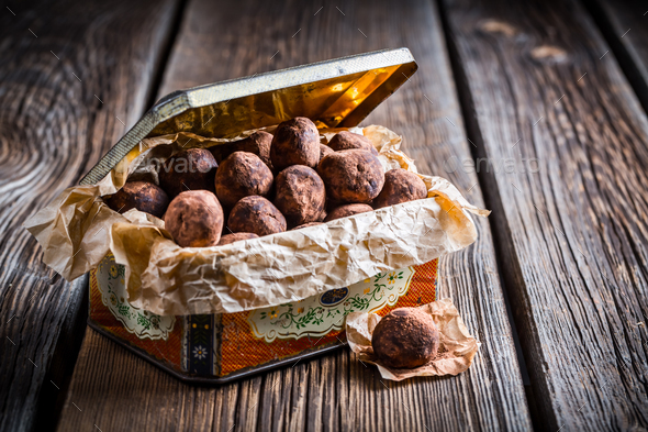 Chocolate balls in the old red box Stock Photo by Shaiith | PhotoDune