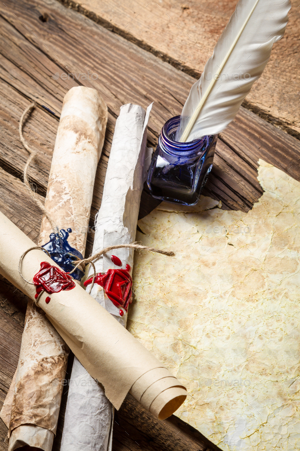 Ancient scrolls writing by feather with blue ink Stock Photo by Shaiith
