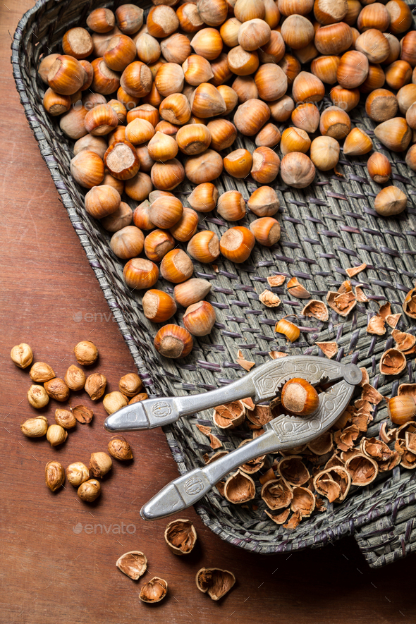 Cracked nuts in an old wicker basket Stock Photo by Shaiith | PhotoDune