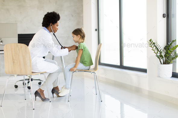 Cute little girl at the pediatrician examination Stock Photo by BGStock72