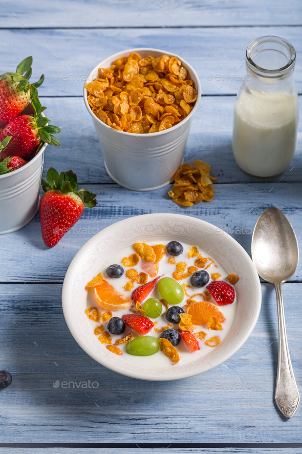 Corn flakes with fruit and milk Stock Photo by Shaiith | PhotoDune