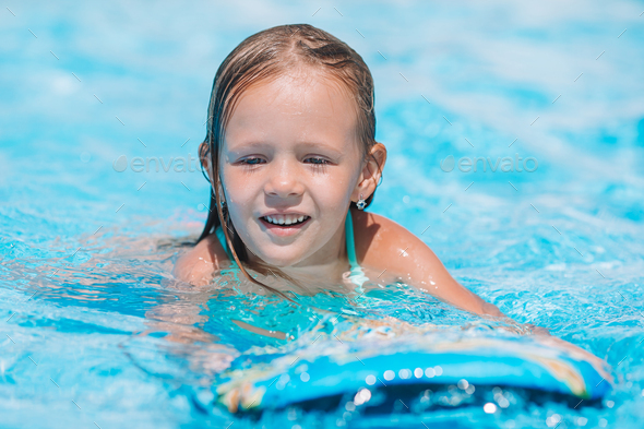 Little adorable girl in outdoor swimming pool Stock Photo by ...
