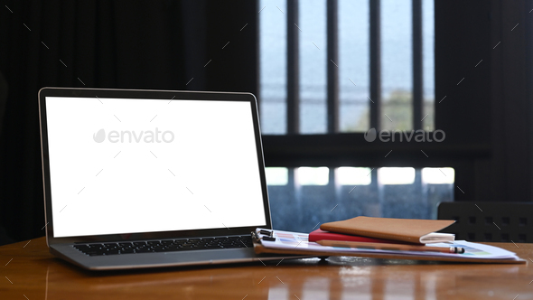 Modern office desk with laptop computer, notebook and documents. Stock ...