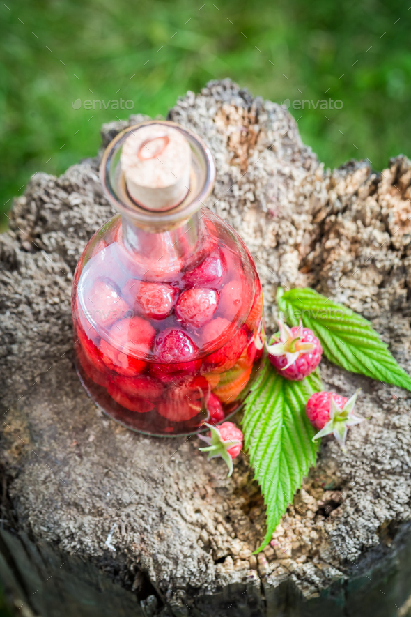 Strong raspberries liqueur made of fruits and alcohol Stock Photo by ...