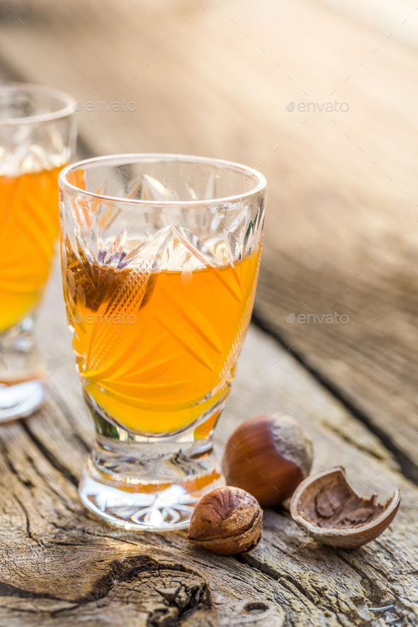Delicious liqueur made of alcohol and hazelnuts Stock Photo by Shaiith