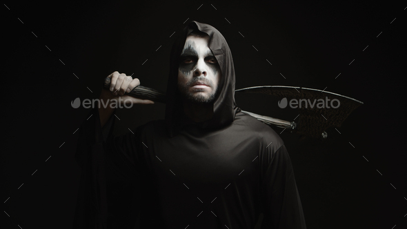 Grim reaper over black background with axe in his hands Stock Photo by ...