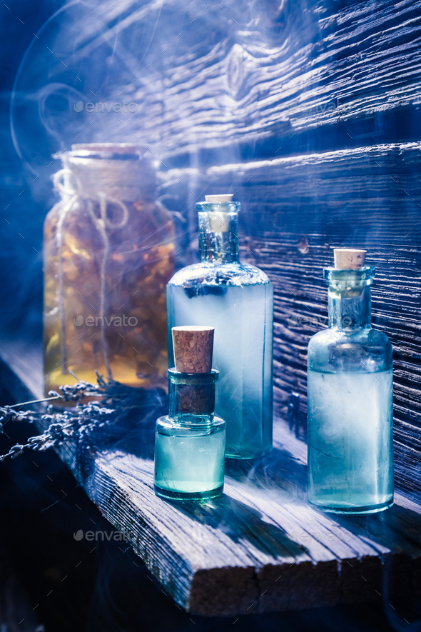 Magical lab full of blue potion for Halloween Stock Photo by Shaiith