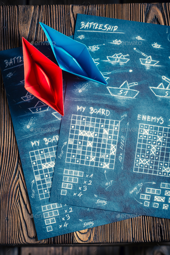 Homemade battleship paper game as a battle concept Stock Photo by Shaiith