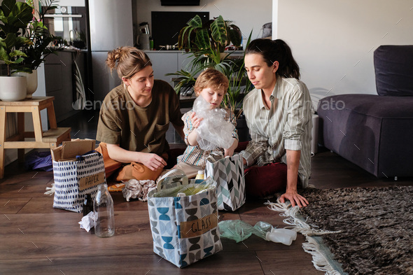 Family with child sorting garbage Stock Photo by AnnaStills | PhotoDune
