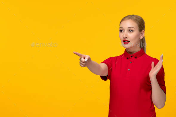 red shirt day cute girl pointing to the front in a red shirt on a ...