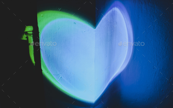 Colorful light heart shape projected in a wall Stock Photo by nanihta