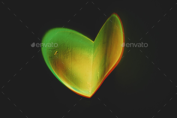 Colorful light heart shape projected in a wall Stock Photo by nanihta