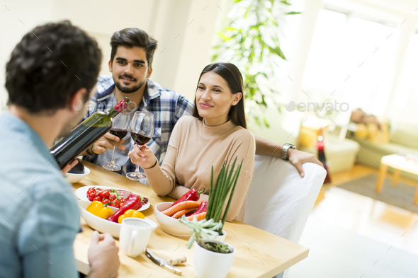 Young people sitting by the table Stock Photo by BGStock72 | PhotoDune