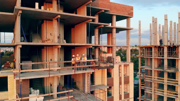 High-rise Building in Progress with Engineers Standing in It, Stock Footage