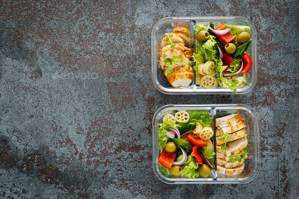 Lunch boxes with grilled chicken breast and pasta salad with fresh ...
