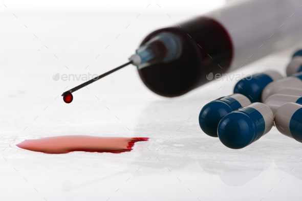 Macro view of drop of blood from syringe Stock Photo by seleznev_photos