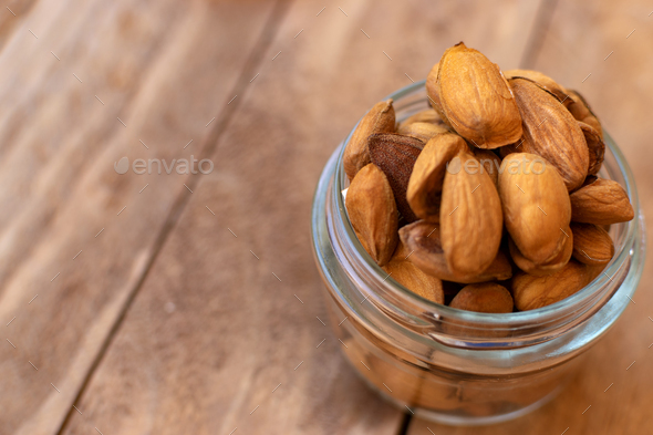 Raw almonds inside a pot, Stock Photo by armacuatro | PhotoDune
