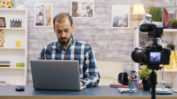 Creative content creator recording review of laptop Stock Photo by DC ...
