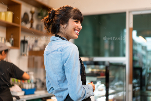 Portrait of happy coffee shop owner welcome greeting customer Stock ...