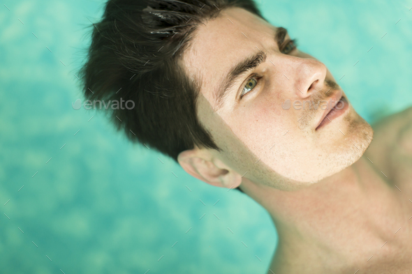 Man floating in the pool Stock Photo by BGStock72 | PhotoDune
