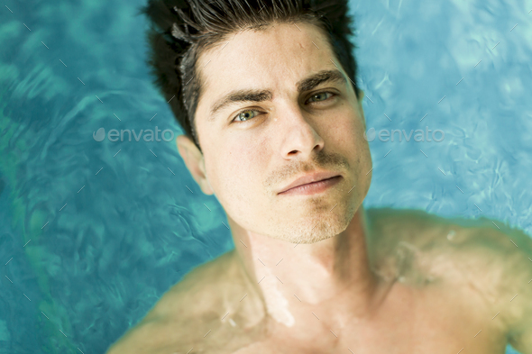 Man floating in the pool Stock Photo by BGStock72 | PhotoDune