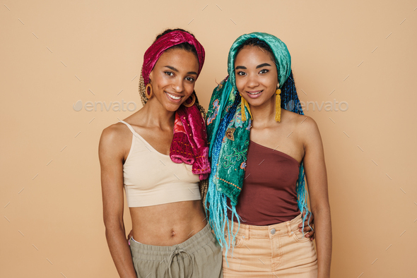 Young black two women hugging while posing on camera Stock Photo by ...