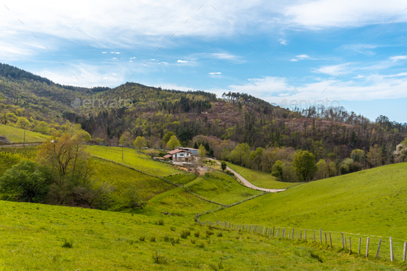 Traditional Basque farmhouse on top of Mount Andatza in a natural ...