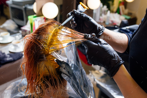 Process of coloring hair, Applying yellow color on hair, Stock Photo by ...