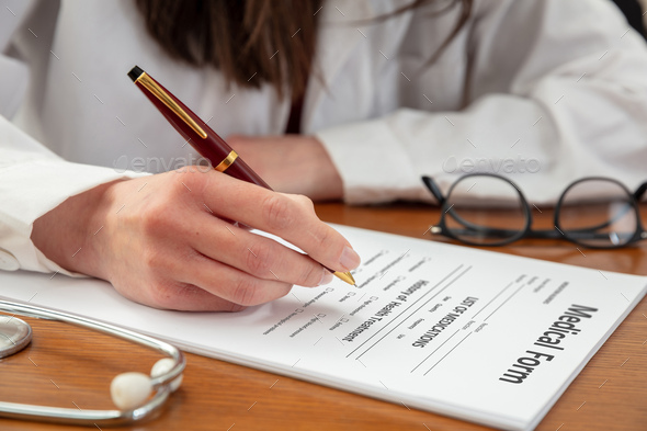 Patient medical form. Woman doctor, wooden office table. Female hand ...