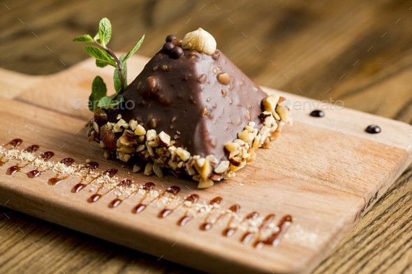 Chocolate pyramid shape cake with nuts Stock Photo by BGStock72 | PhotoDune