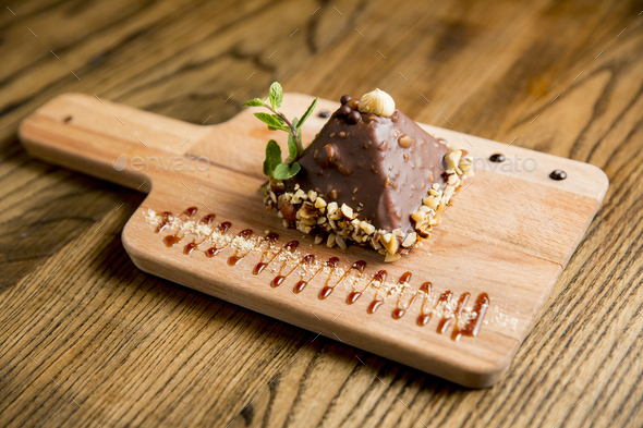 Chocolate pyramid shape cake with nuts Stock Photo by BGStock72 | PhotoDune