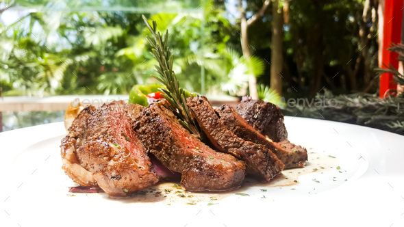 close up of a medium rare of meat cooking Stock Photo by borsattomarcos