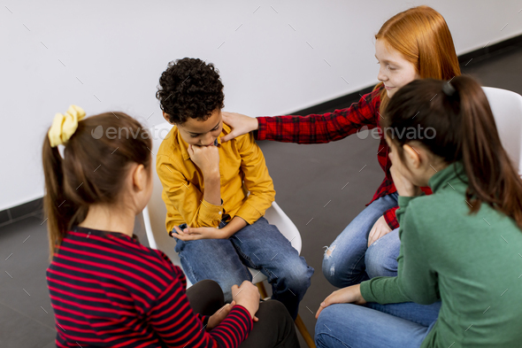 Sad little boy and supporting friends Stock Photo by BGStock72 | PhotoDune