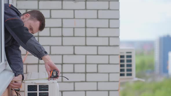 The Wizard Checks the Correct Installation of the Air Conditioner Unit ...