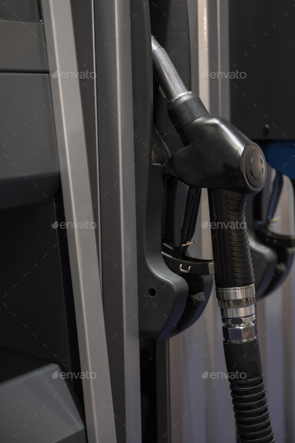 Fuel pistol on the petrol station Stock Photo by BGStock72 | PhotoDune