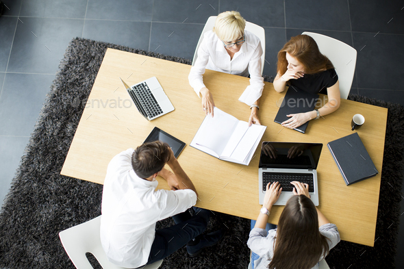 Teamwork in the office Stock Photo by BGStock72 | PhotoDune